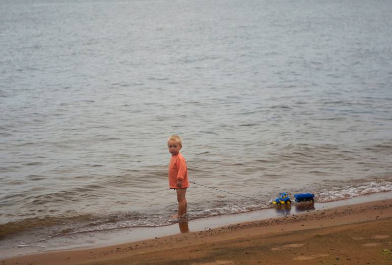 child with a toy basque in the sea - Limited Edition of 5 Photography ...