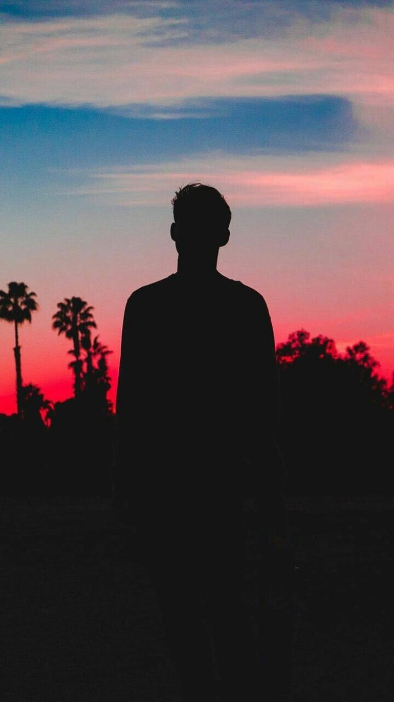 Lonely man in red sunset sky Photography by Ron Meijer | Saatchi Art