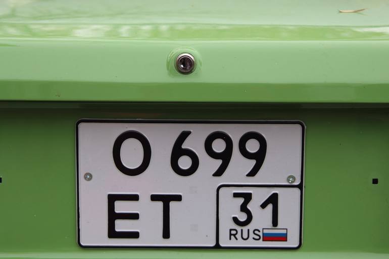 The license plate of an old green car. Light. - Limited Edition of 1 ...