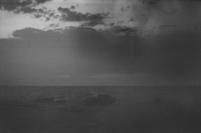 The boundary of the real / Fog over the sea and a lonely car ...
