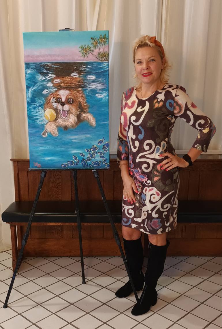 Cheerful dog dives for a ball in the sea in the Maldives Painting by ...