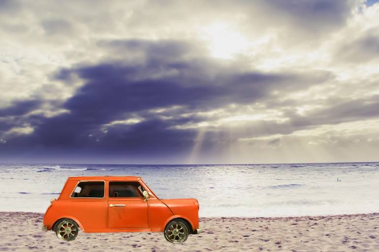 orange classic car on the sandy beach with beautiful sky and beach ...