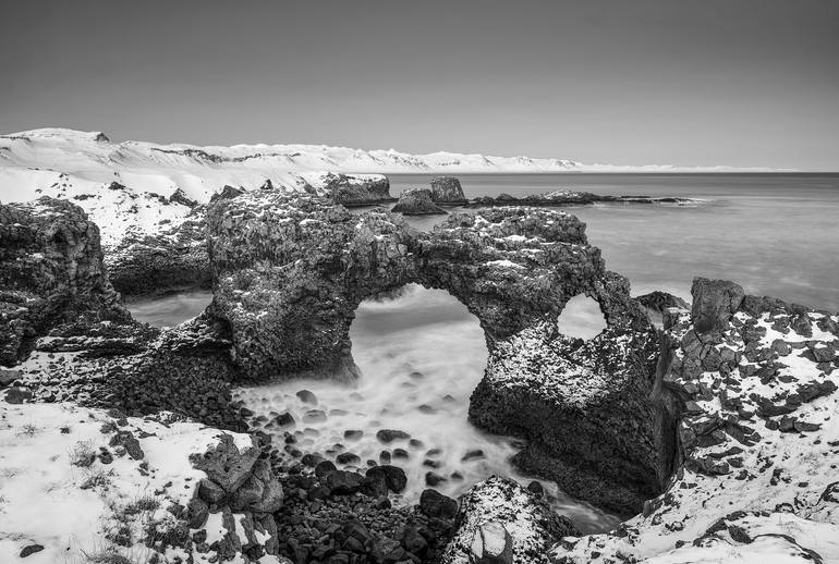 Twilight over the sea arch at Arnarstarpi, Iceland. Photography by ...